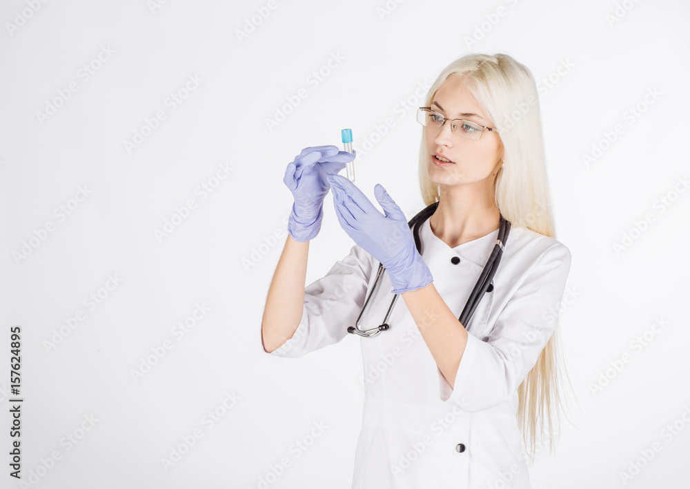 Female doctor with stethoscope holding medical vial, Stock Photo ...