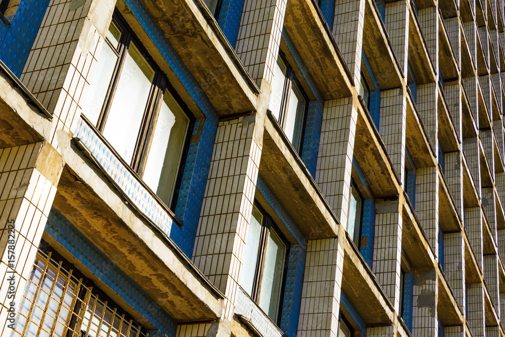 Residential cells of the hostel building. Facade of the building with ...