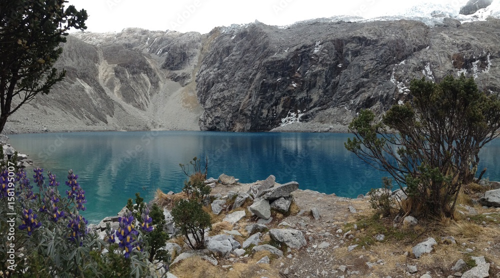 Beautifully frames view of an alpine lace and surrounding nature in the ...