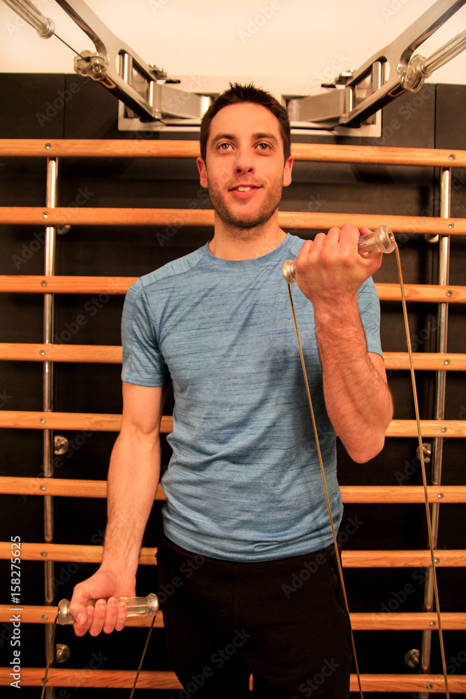 Man working fitness sport exercise for biceps on kinesis technology ...