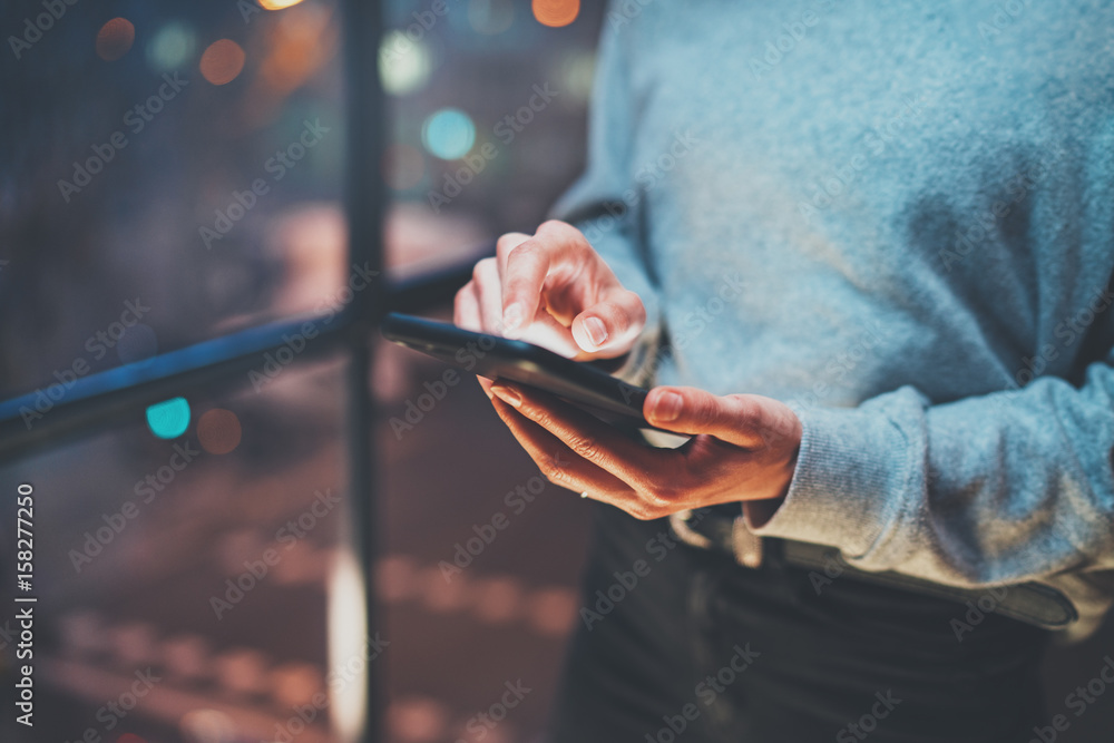 Closeup view of woman holding modern mobile phone in hands.Girl ...