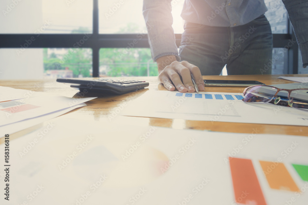 Business man do turnover graph chart financial paper of company and ...