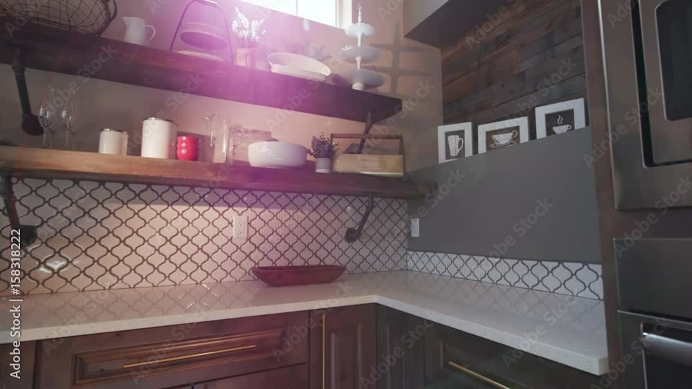 Rising Modern Kitchen Corner with Lens Flare. lowering shot in the ...