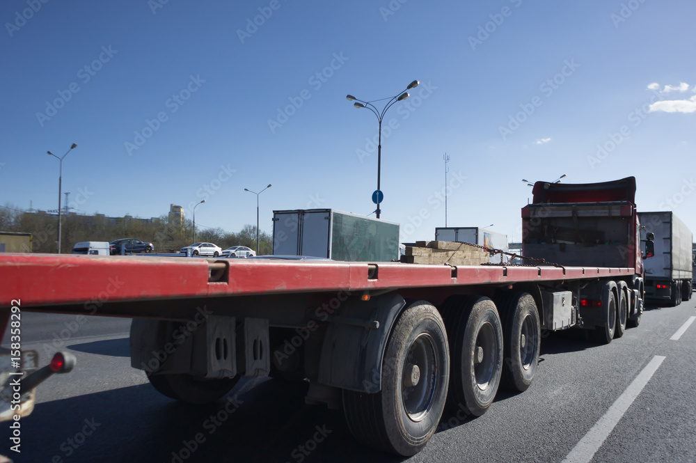 Large powerful big rig semi truck with a trailer for transportation of ...