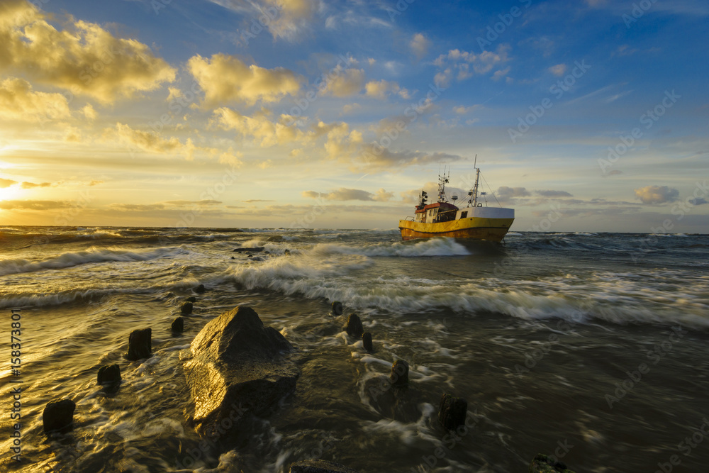 Fishing boat fighting with waves during a storm at sea Stock Photo ...