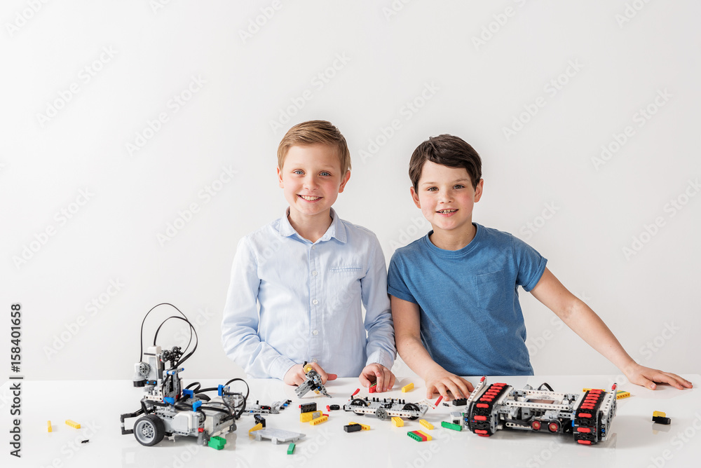 Hilarious smiling male kids standing Stock Photo | Adobe Stock