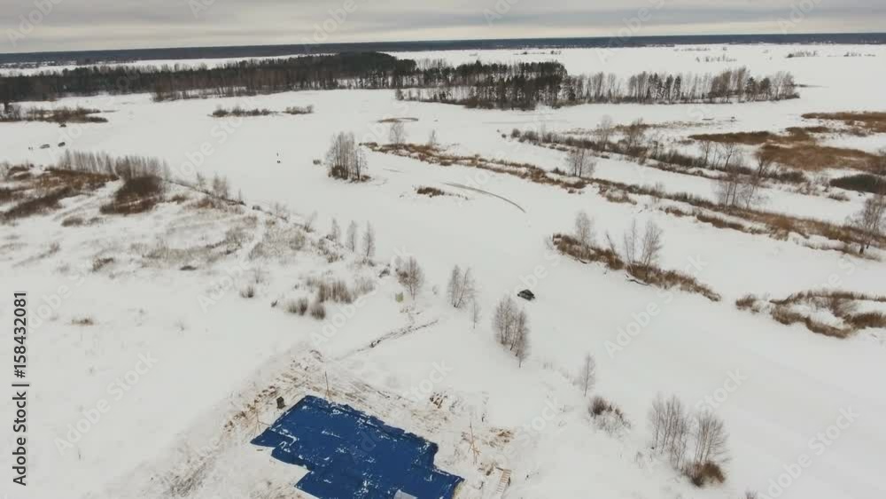 Winter off-road racing side-by-side vehicles. Aerial view: Rally on the ...