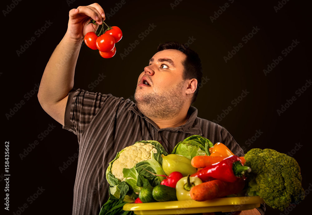 Diet fat man eating healthy food. Health breakfast with vegetables ...