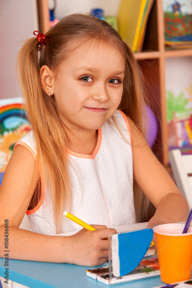 Small students painting in art school class. Child drawing by paints on ...