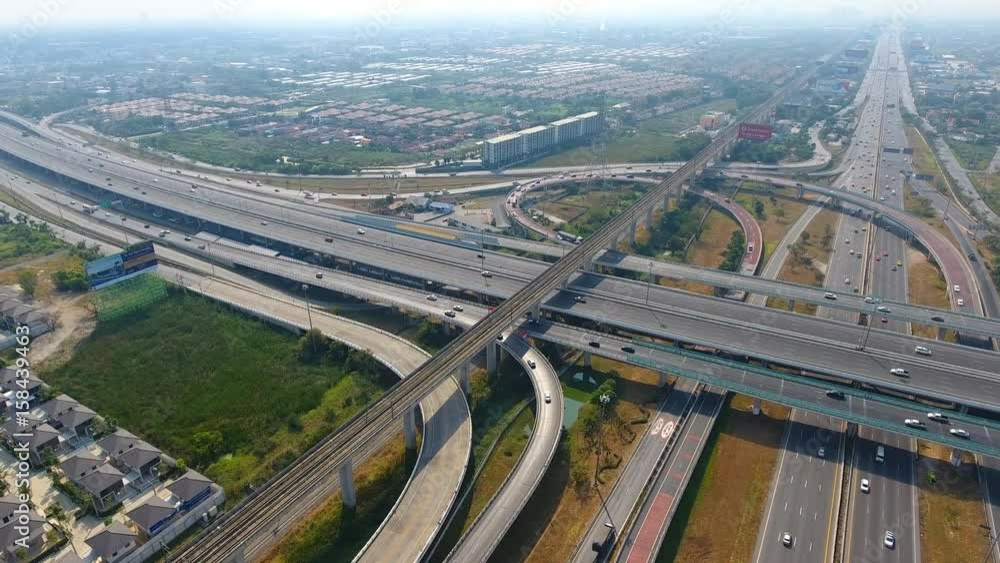 Aerial view of busy city traffic at an intersection on a major freeway ...