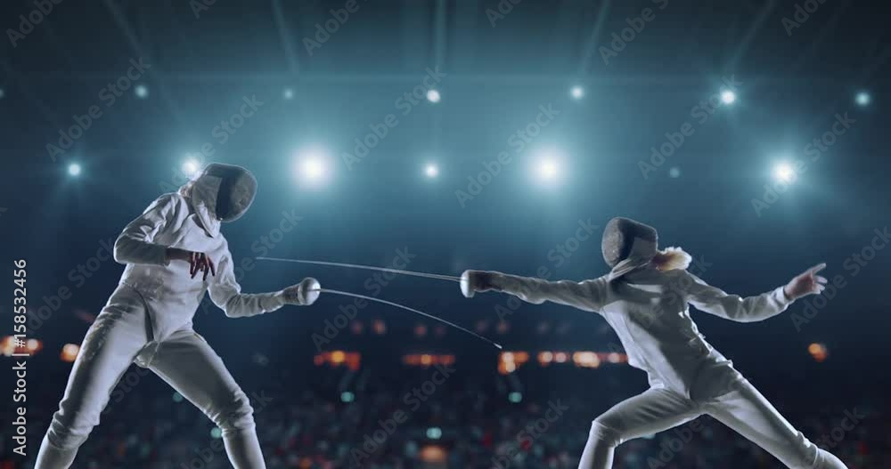 4K video in slow motion of two female fencing athletes. The action ...
