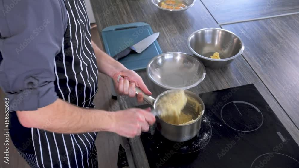 Chef cooking dessert on a modern kitchen at home Stock Video | Adobe Stock
