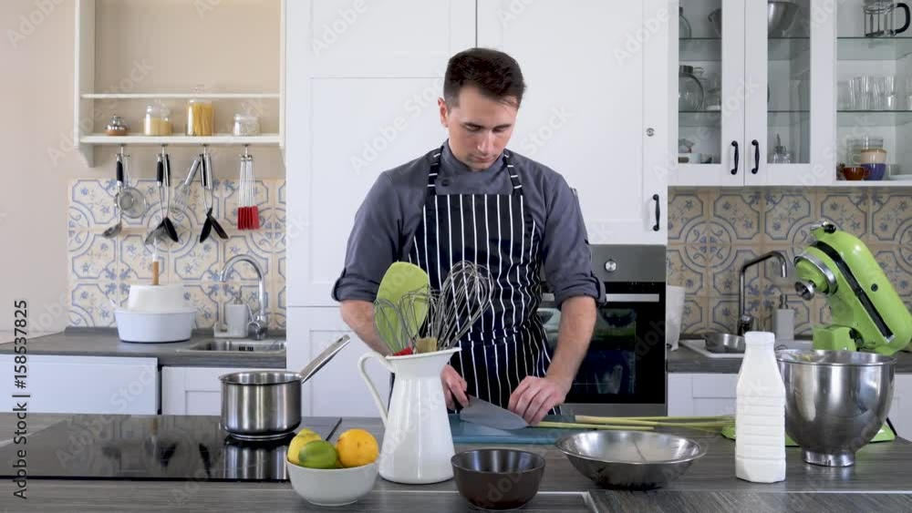 Chef cooking dessert on a modern kitchen at home Stock Video | Adobe Stock