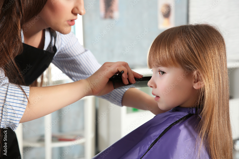 Cute little girl in hairdressing salon Stock Photo | Adobe Stock