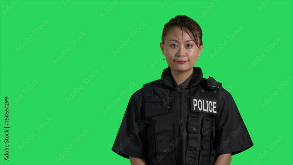 Chinese police officer in flak jacket smiles at camera Stock Video ...