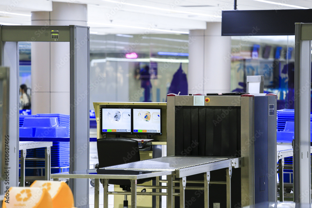 Checkpoint in Airport security with metal detector and X ray scanner ...