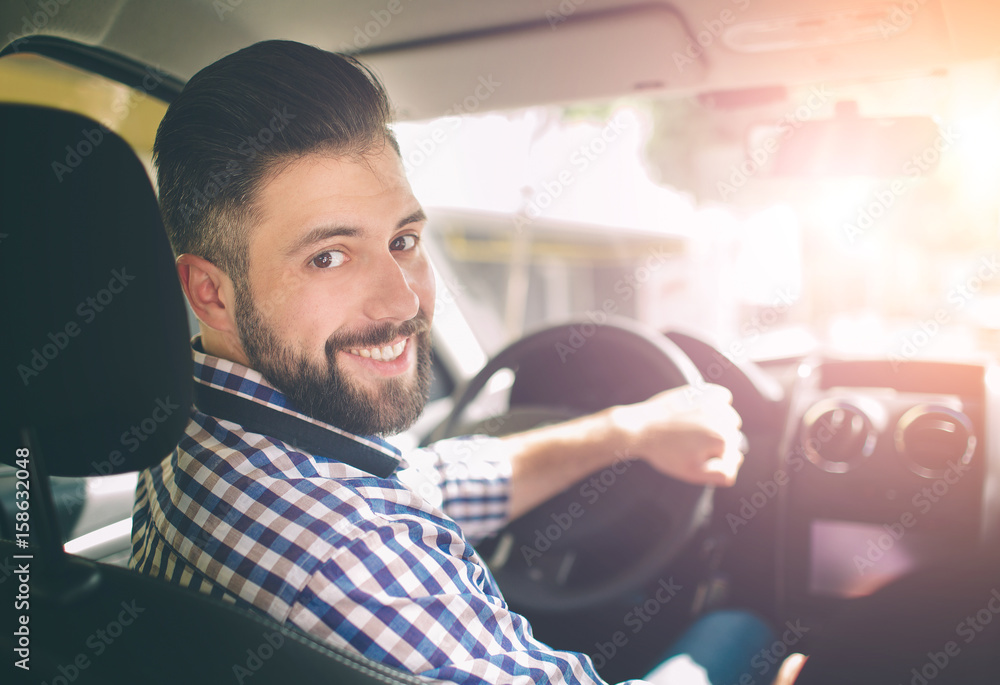 Handsome elegant serious man drives a car Stock Photo | Adobe Stock