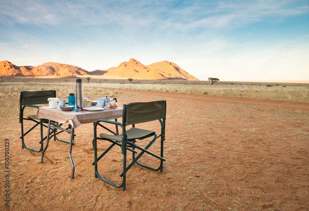 Camping table and chairs in the desert. Great view. Sunrise. Stock ...