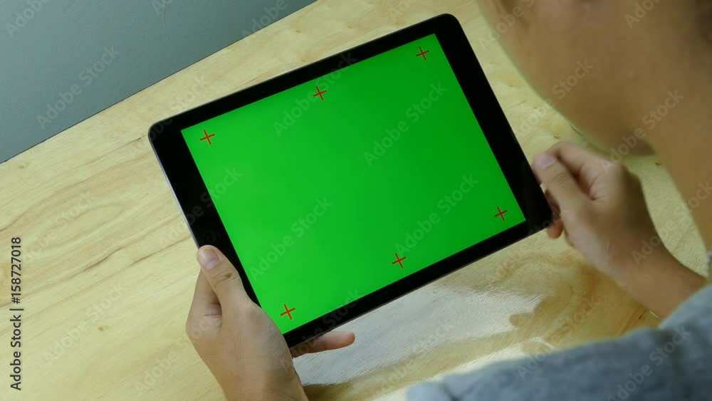 Using Tablet with Green Screen. Black color tablet green screen. Stock ...