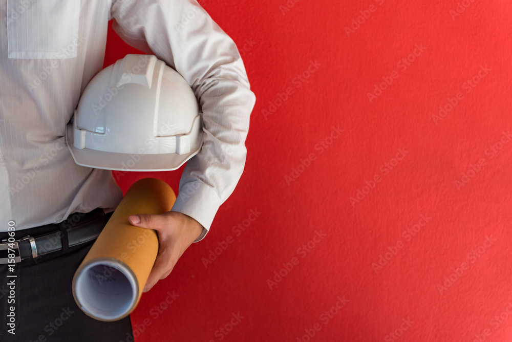 Engineer or Architect holding personal protective equipment safety ...