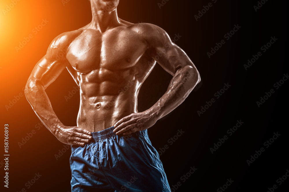 Muscular and fit young bodybuilder fitness male model posing ove Stock ...