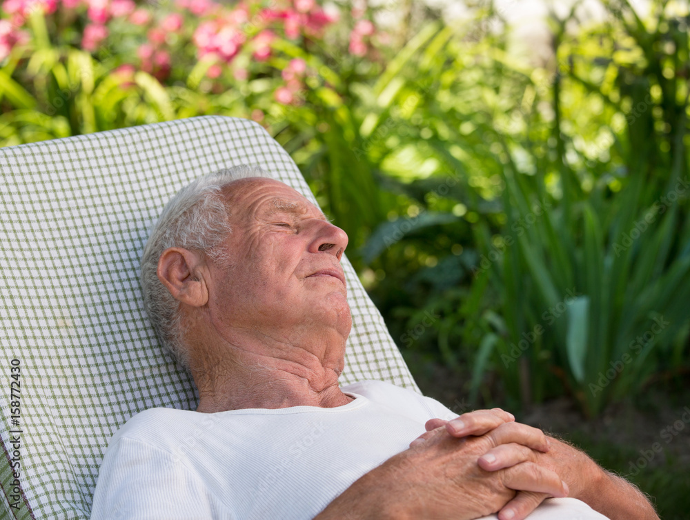 Old man sleeping in garden Stock Photo | Adobe Stock