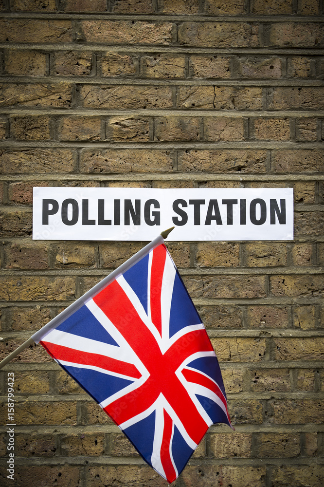 Union Jack flag hanging in front of British election polling station ...