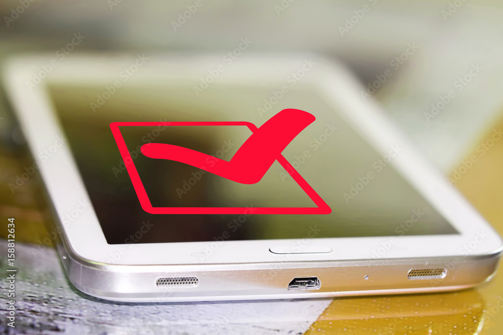 The checkbox with the tick on the cell phone screen . The concept of ...