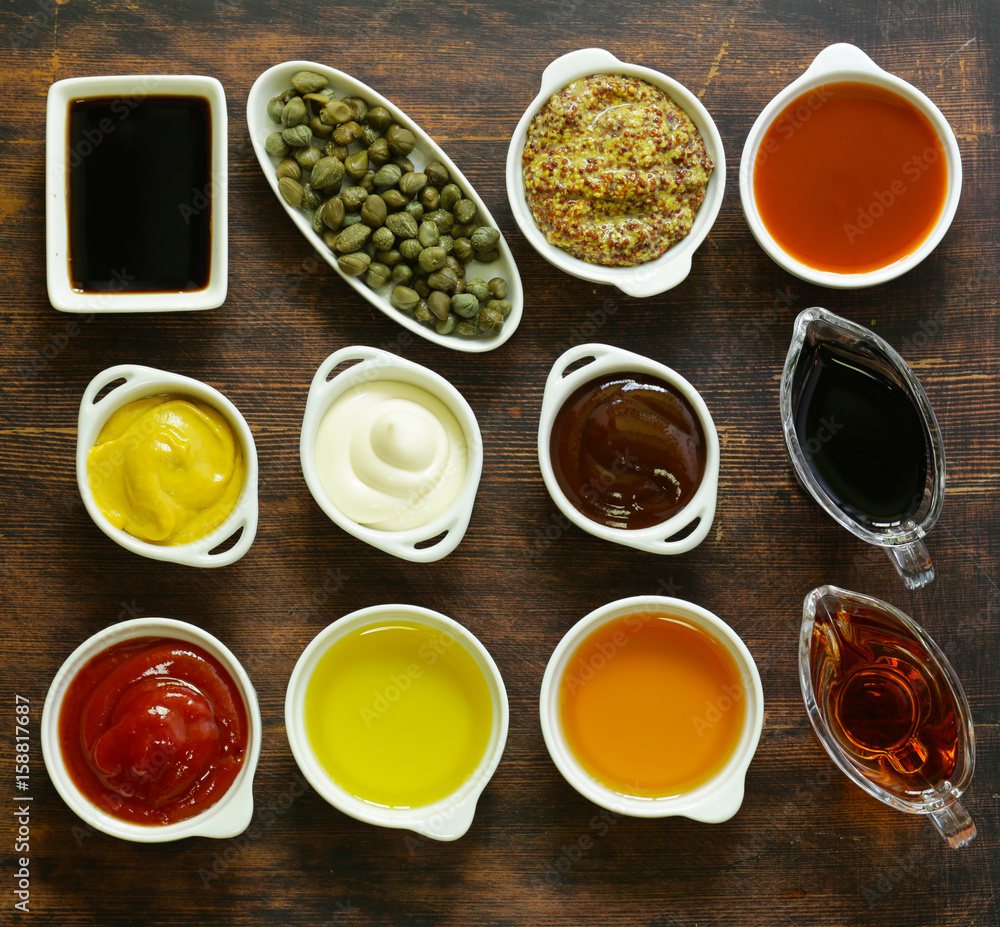 Different types of sauces and oils in bowls, top view Stock Photo ...