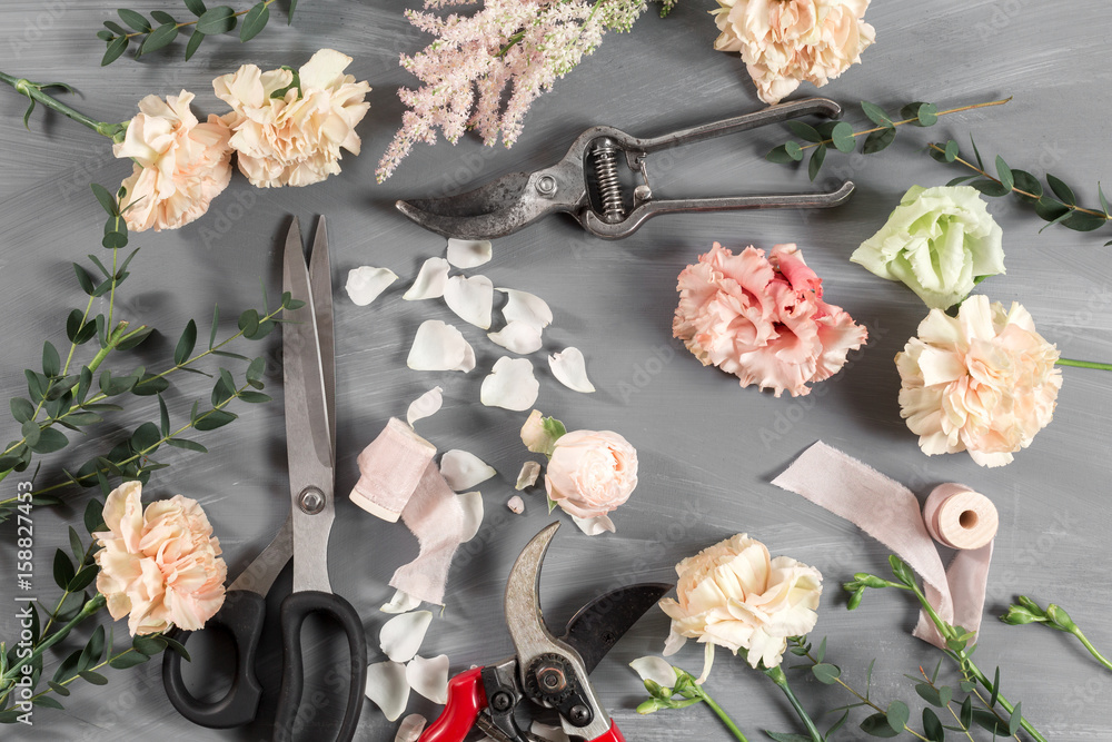 flowers and garden tools. The florist work table with accessories gray ...