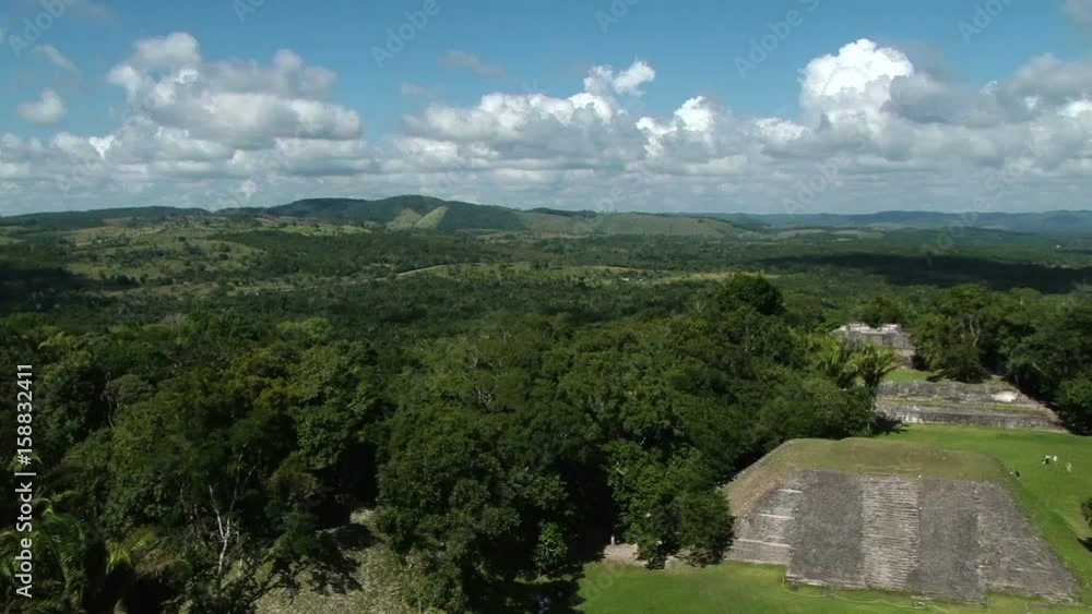 Pan from left to right from the top of temple El Castillo at ...