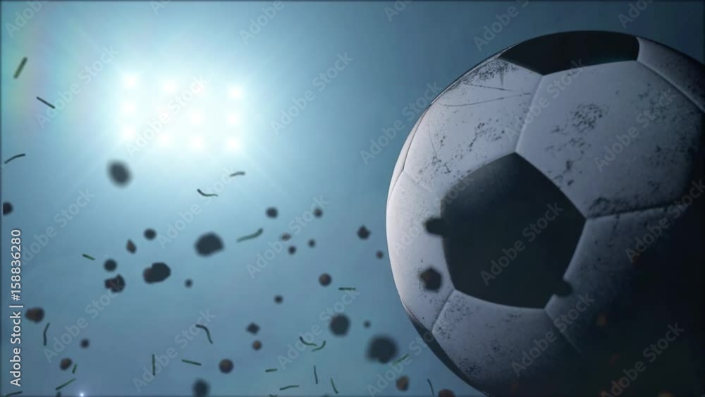 Soccer ball realistic rotation with stadium light behind in slow motion ...