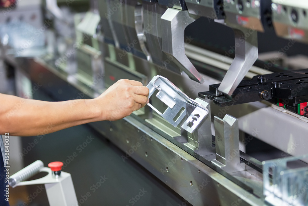 operator bending metal sheet by sheet bending machine Stock Photo ...