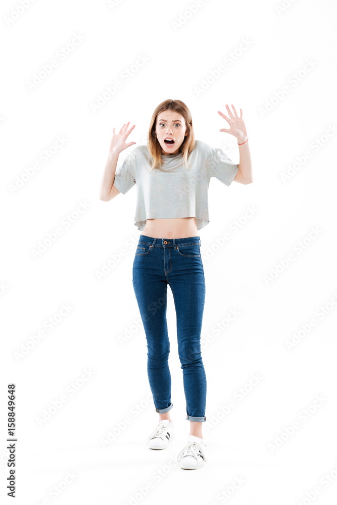 Full length portrait of a fightened girl standing and screaming Stock ...