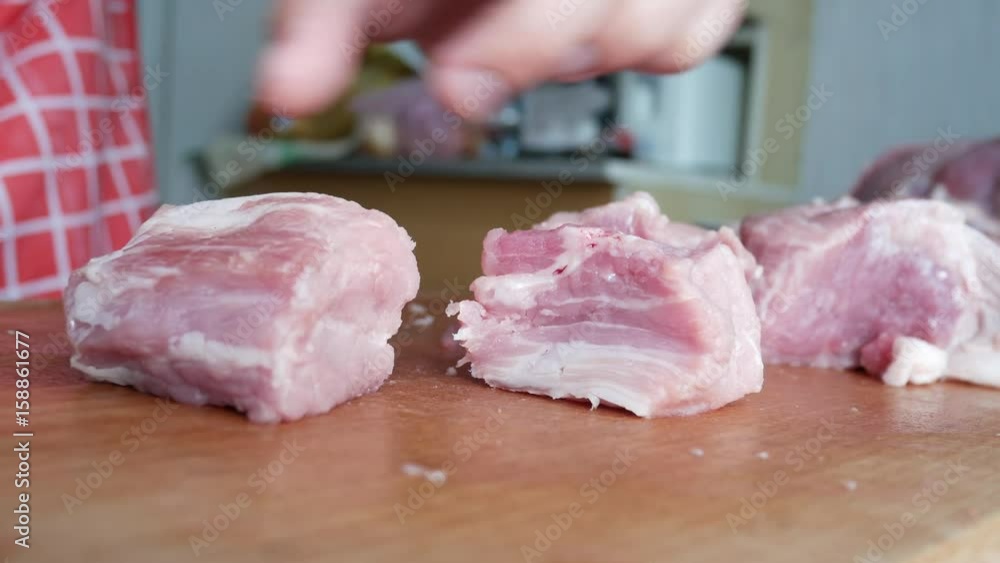 Fat and Sinews Being Cut Away From Fresh Raw Pork Chops. Hand Removing ...
