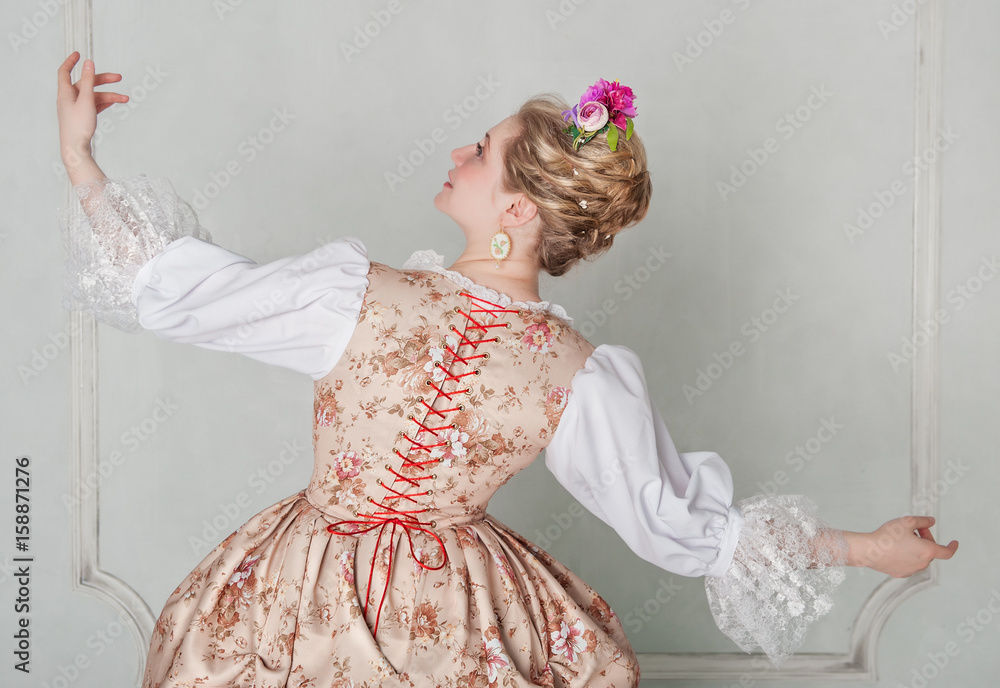 Beautiful woman in historic medieval dress. Back pose Stock Photo ...