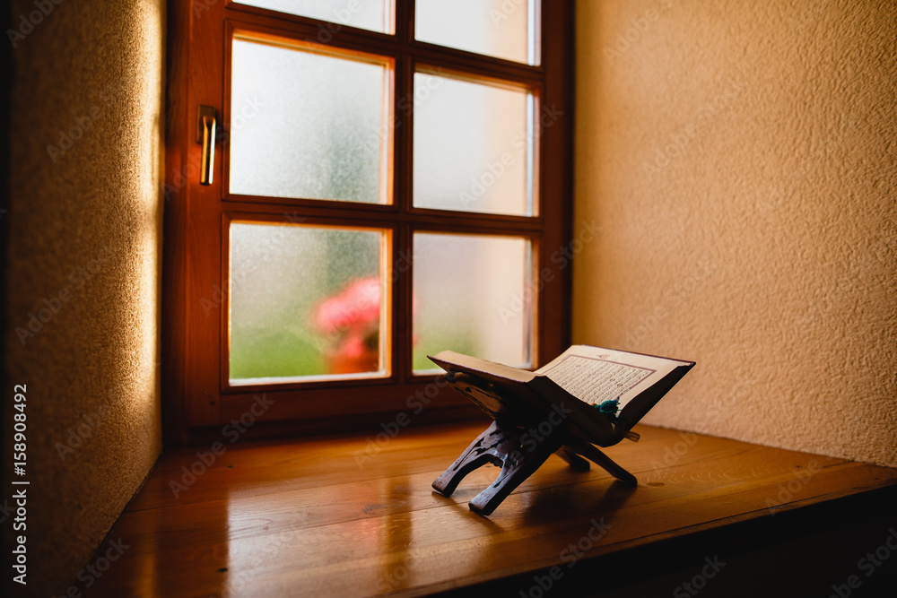 Quran in front of amazing wooden window Stock Photo | Adobe Stock