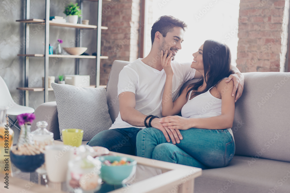 Together forever. A couple of young beautiful lovers are cuddling ...