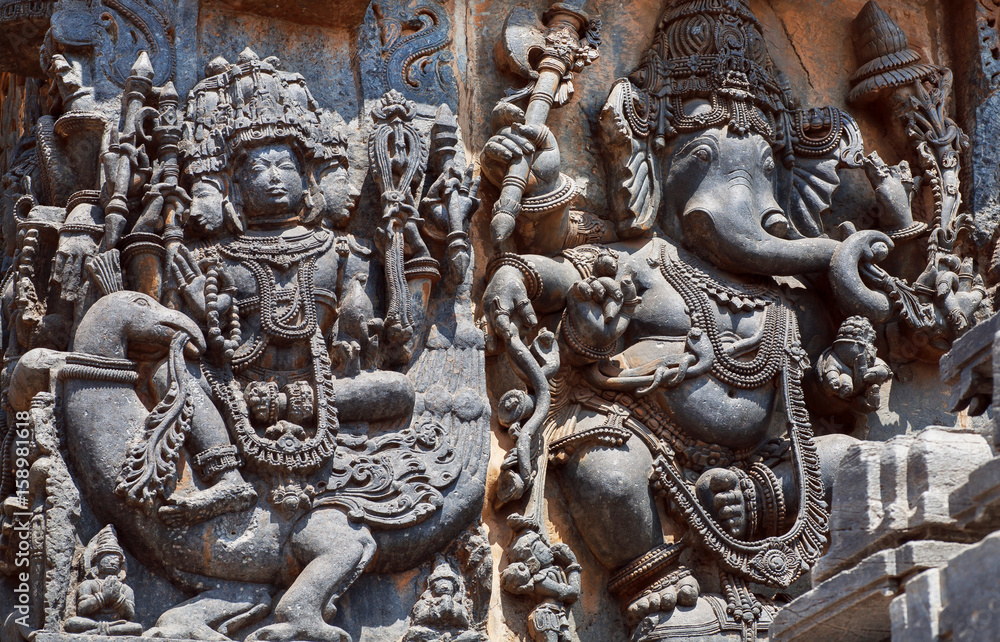 Ancient relief with Lord Brahma on swan and Ganesh, the Hindu temple ...