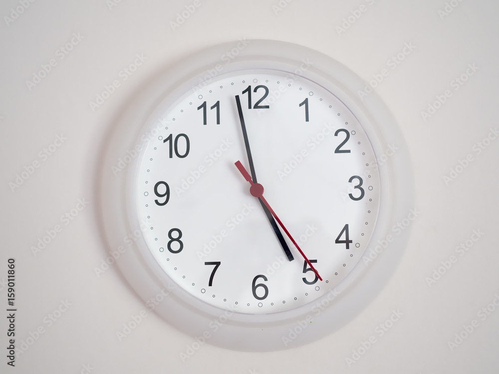 White wall clock Stock Photo | Adobe Stock