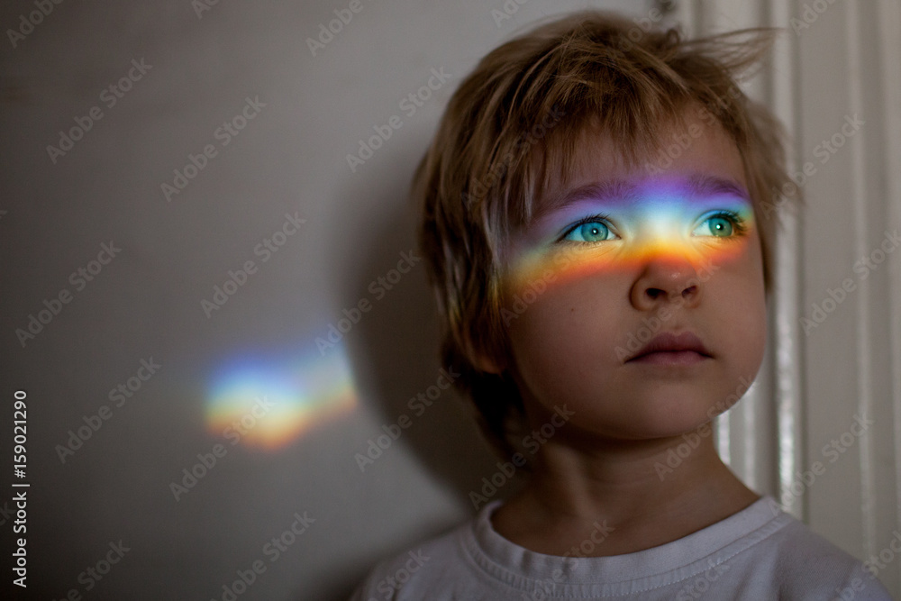 Little girl with a rainbow of light across her eyes Stock Photo | Adobe ...