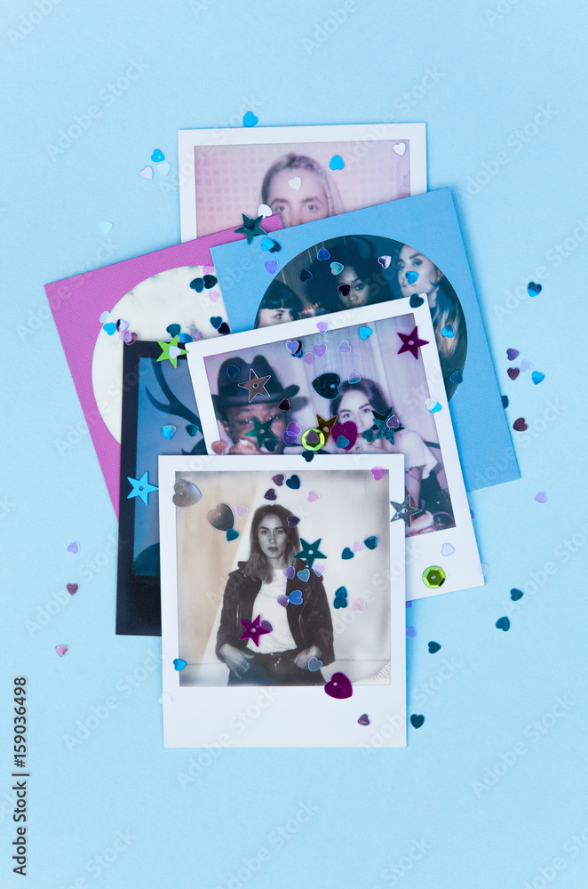 Instant photos of friends on blue background with glitter Stock Photo ...