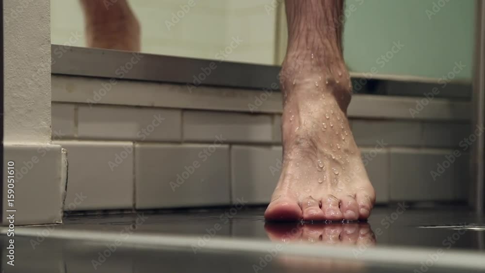 Barefoot human foot stepping on bathroom floor, the risk of infection ...
