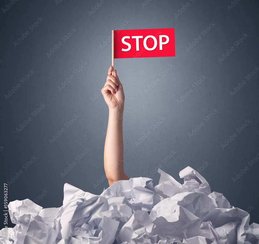 Female hand holding stop sign Stock Photo | Adobe Stock