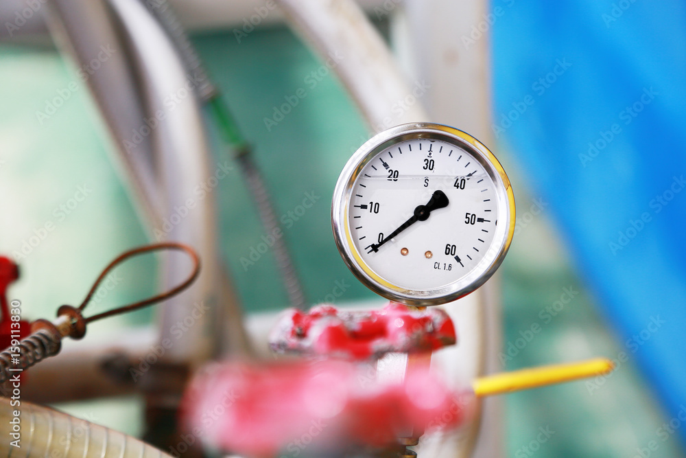Pressure gauge using measure the pressure in production process. Worker ...