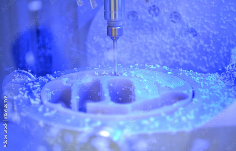 Dental milling machine carving out shape of human teeth close-up. Copy ...