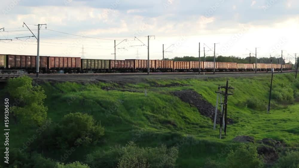 Freight Train Carriages Passing On A Railroad Track At Sunset Stock ...