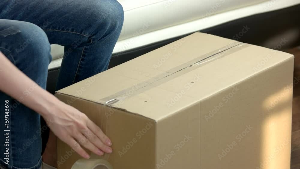 Female hands packing box. Woman with marker writing. Stock Video ...