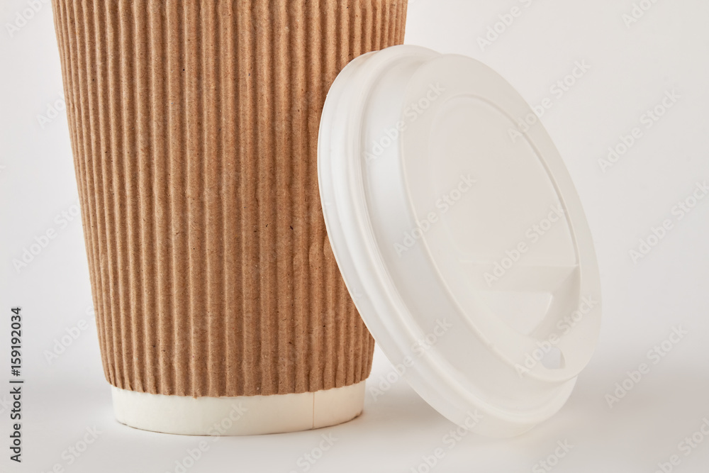 Closeup cardboard cup with lid. Brown paper cup, white background ...