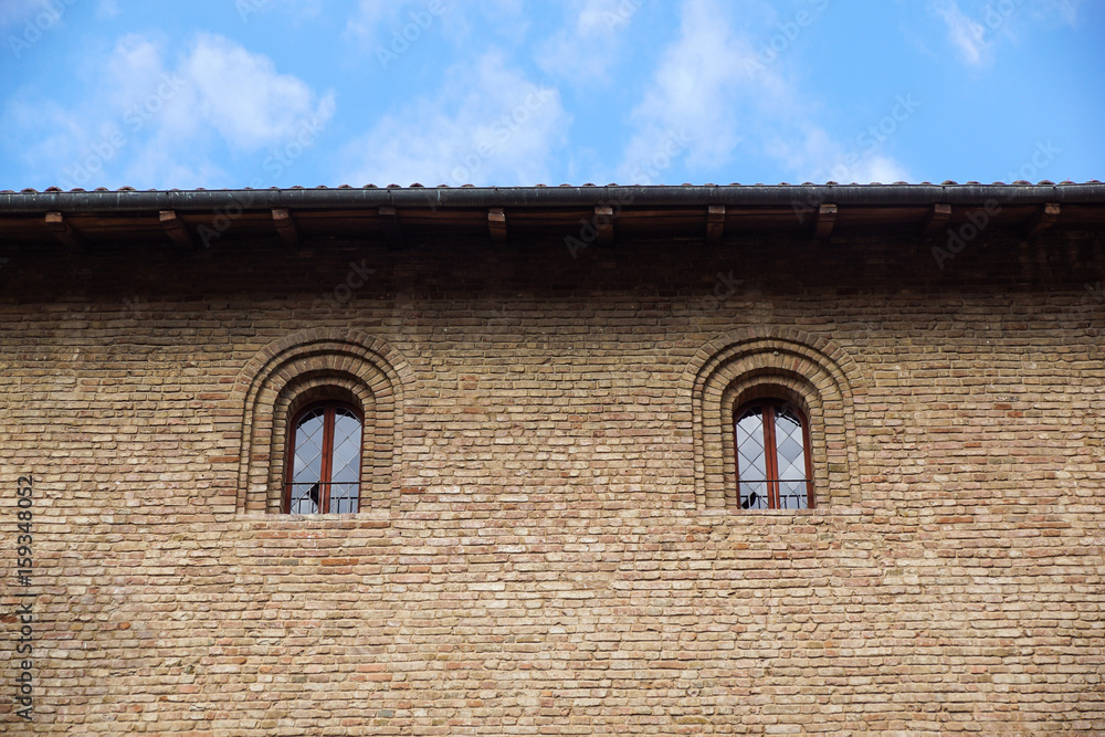 Castle window in a medieval style. Double arched window on a facade of ...